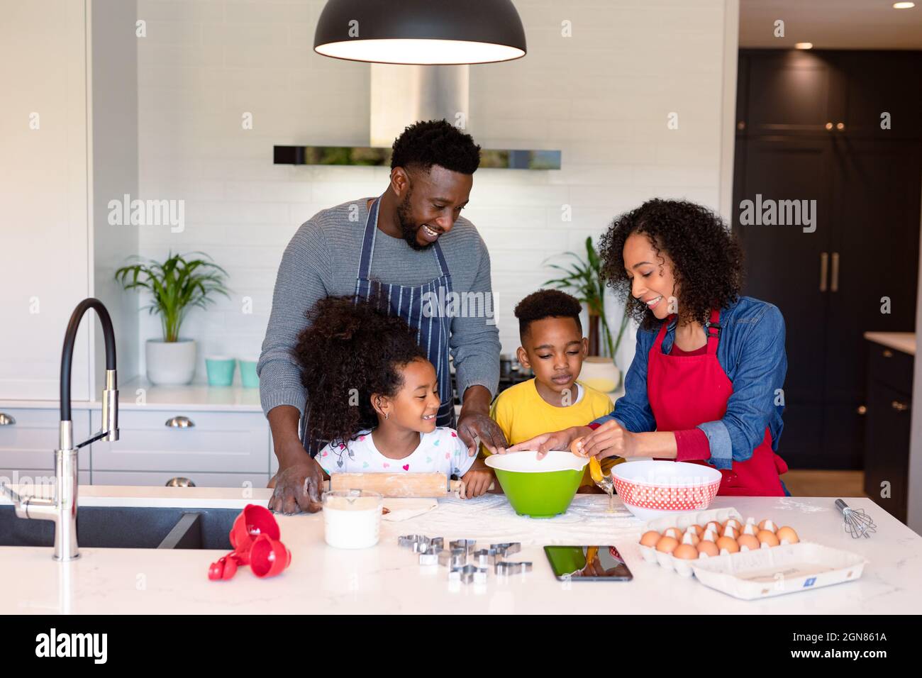 Happy african american family baking together in kitchen Stock Photo ...