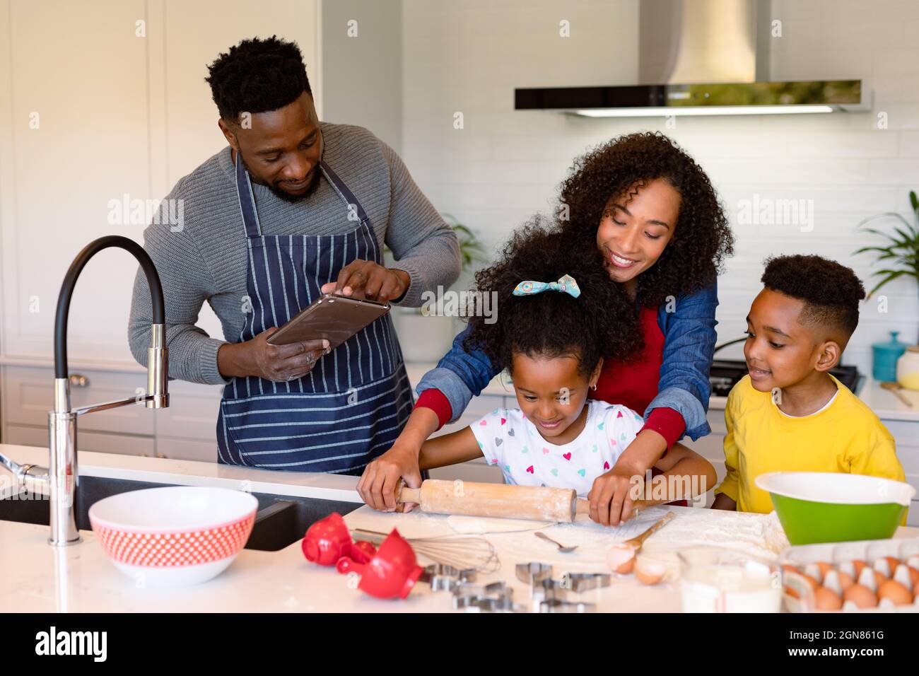 Happy african american family baking together in kitchen Stock Photo ...