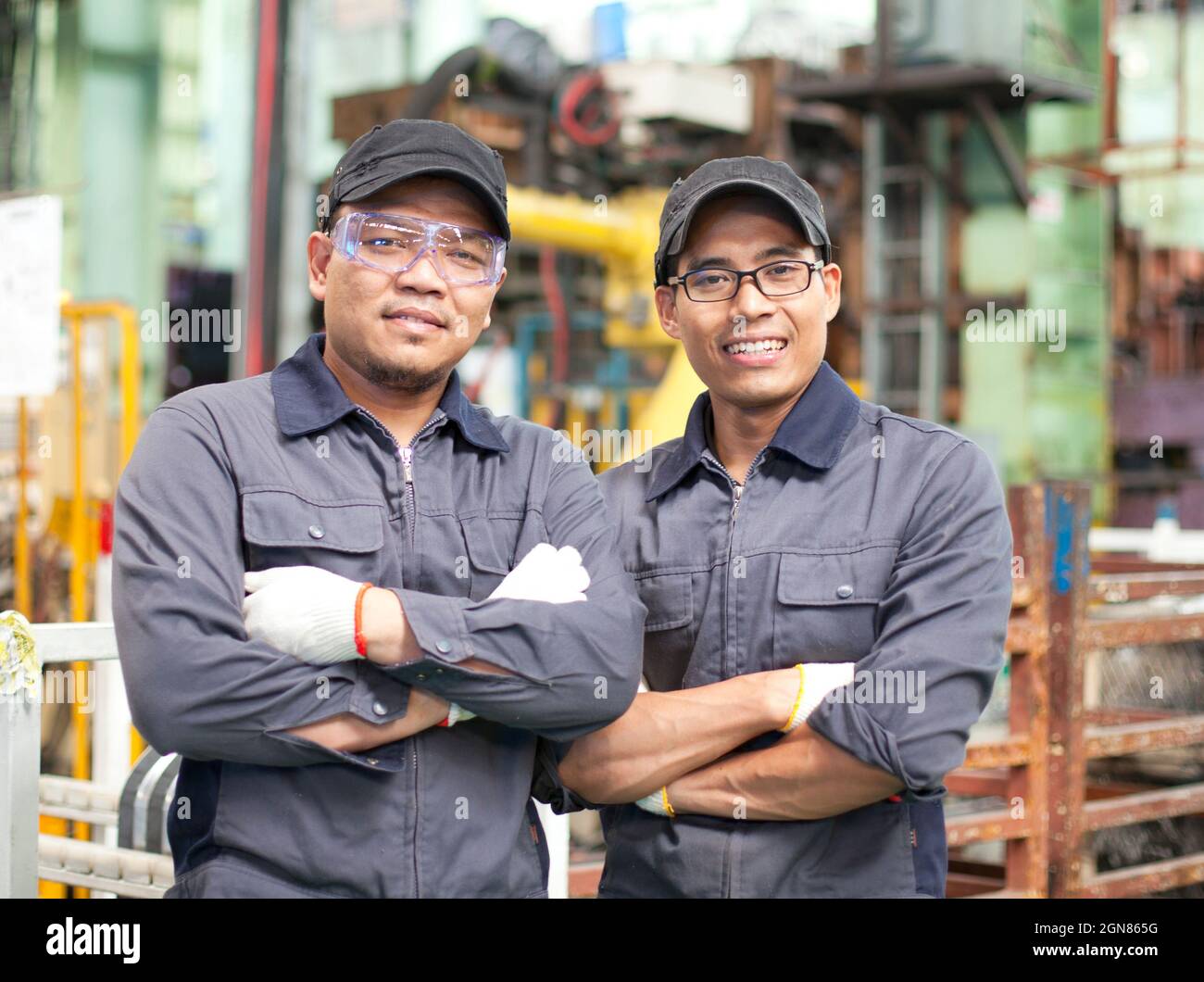 Two factory workers standing hi-res stock photography and images - Alamy