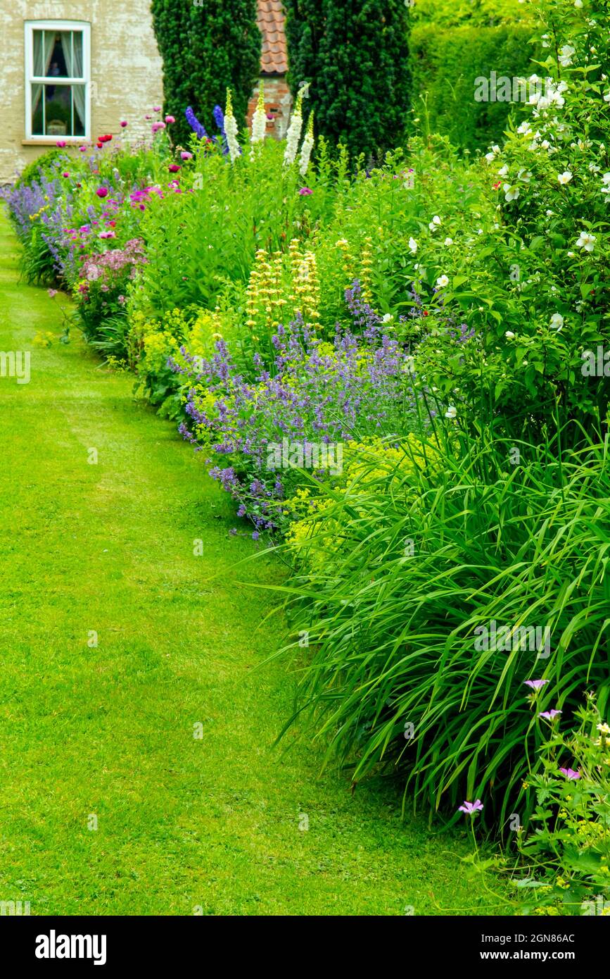 Flowers in borders in June at Goltho Gardens near Wragby in ...