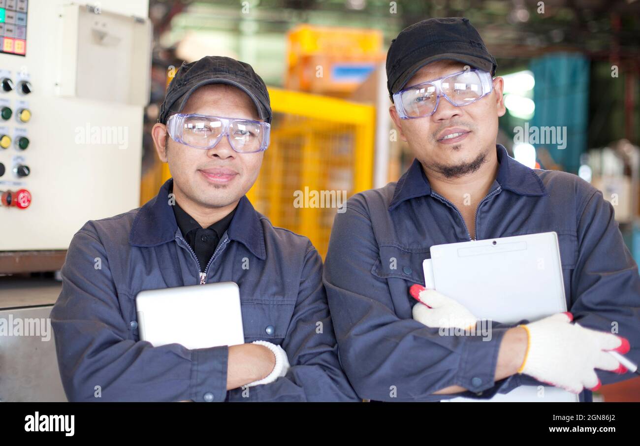 Operator machine standing a beside control panel Stock Photo - Alamy