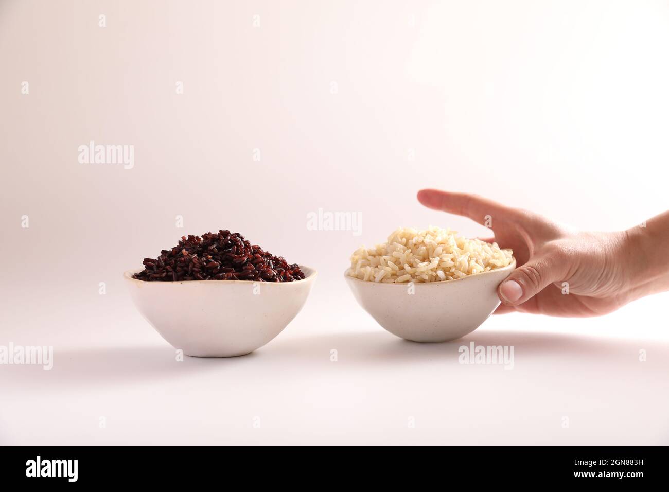 Organic boiled brown rice on bowl isolated in white background Stock ...