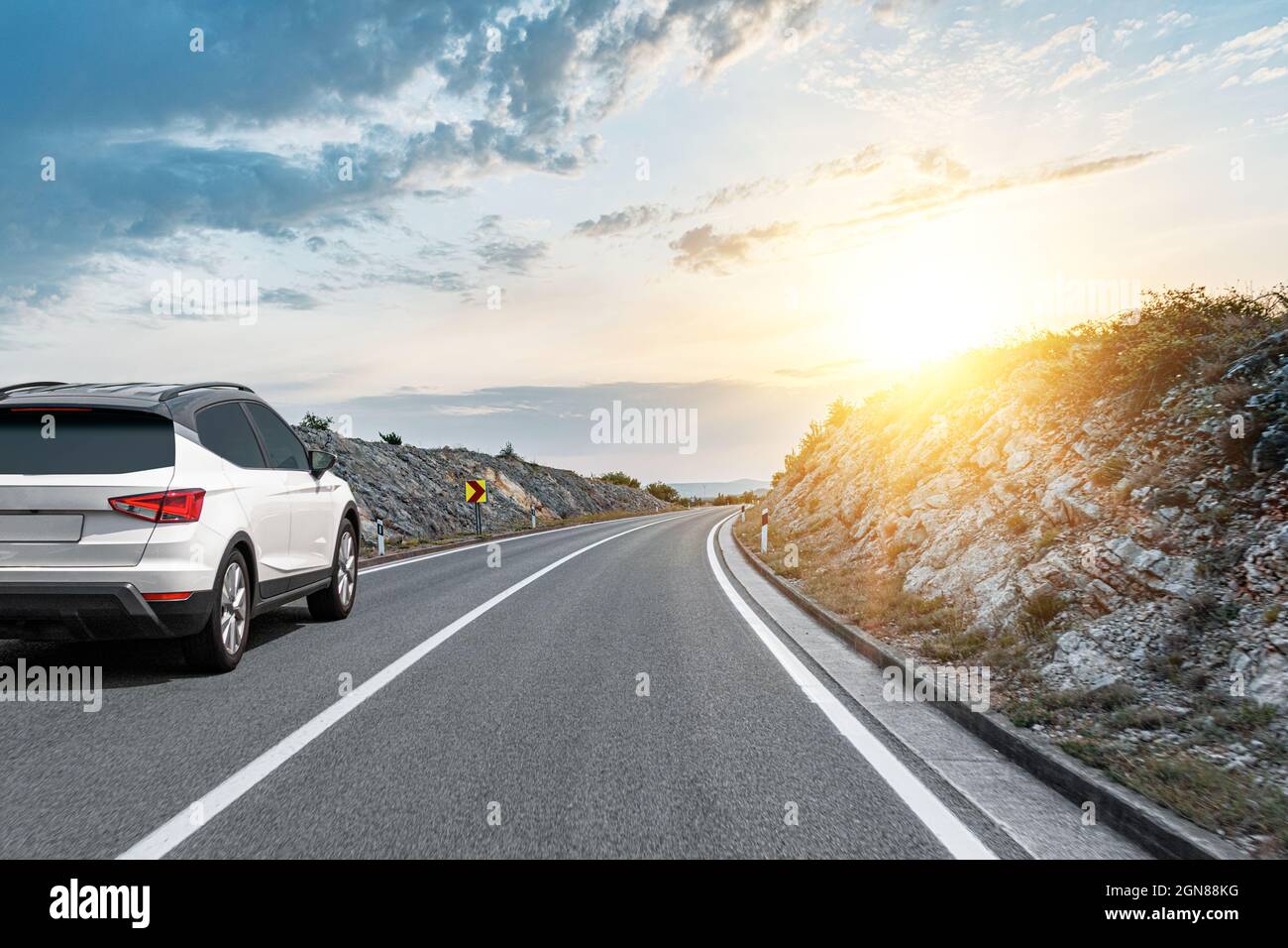 Car is driving along the road. White car on a suburban highway Stock ...