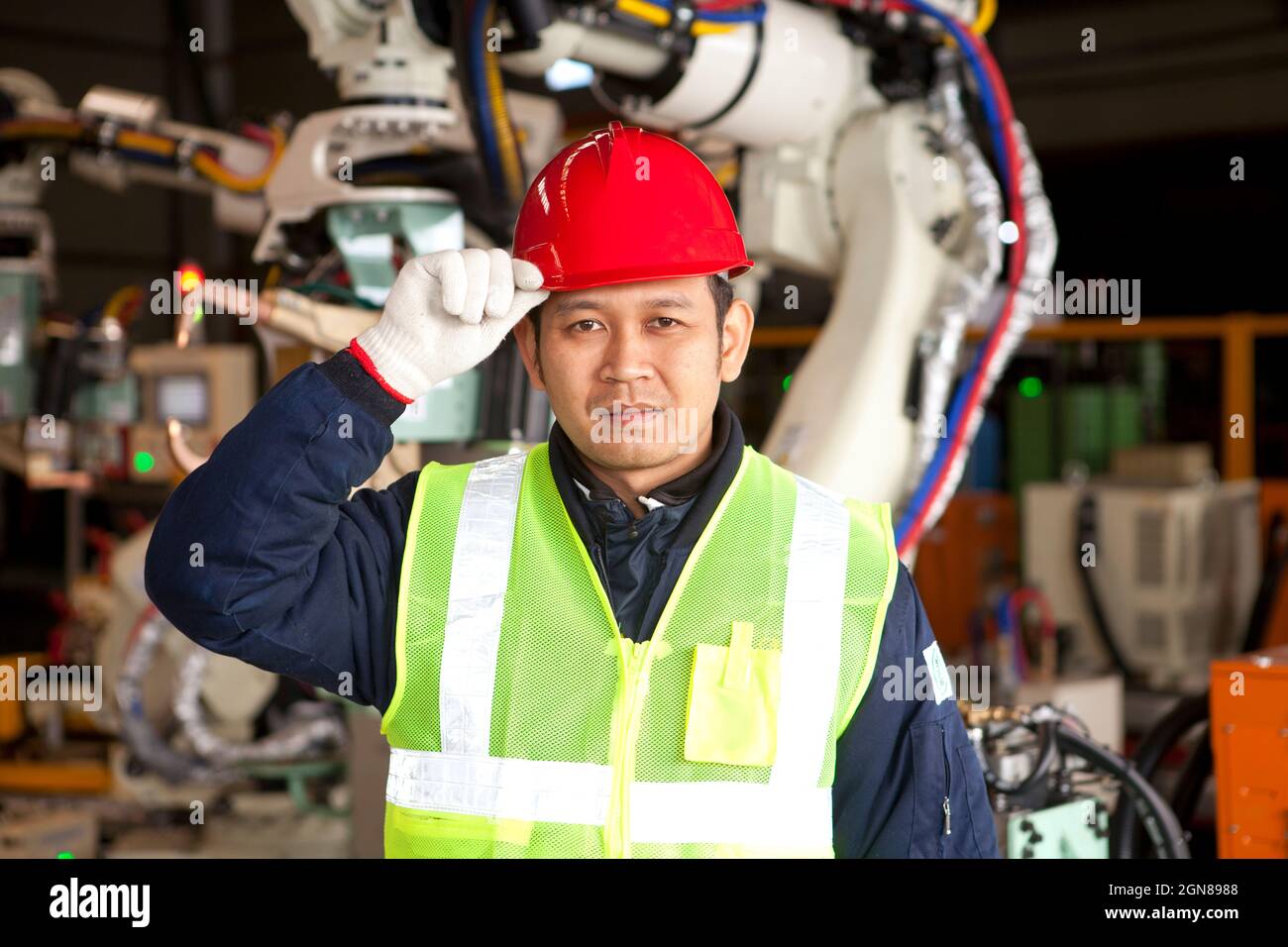 Operator robot machine on posing Stock Photo - Alamy