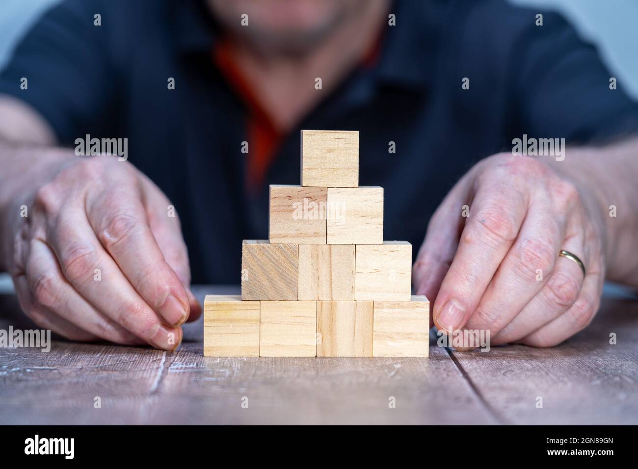 ten wooden blocks pyramid shaped blank template mock up with man in ...