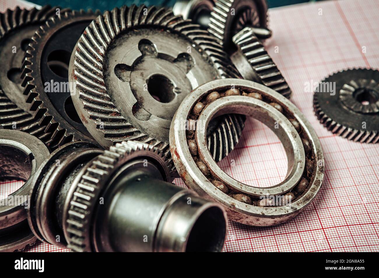 Car parts on graph paper close up. Engineering concept Stock Photo - Alamy