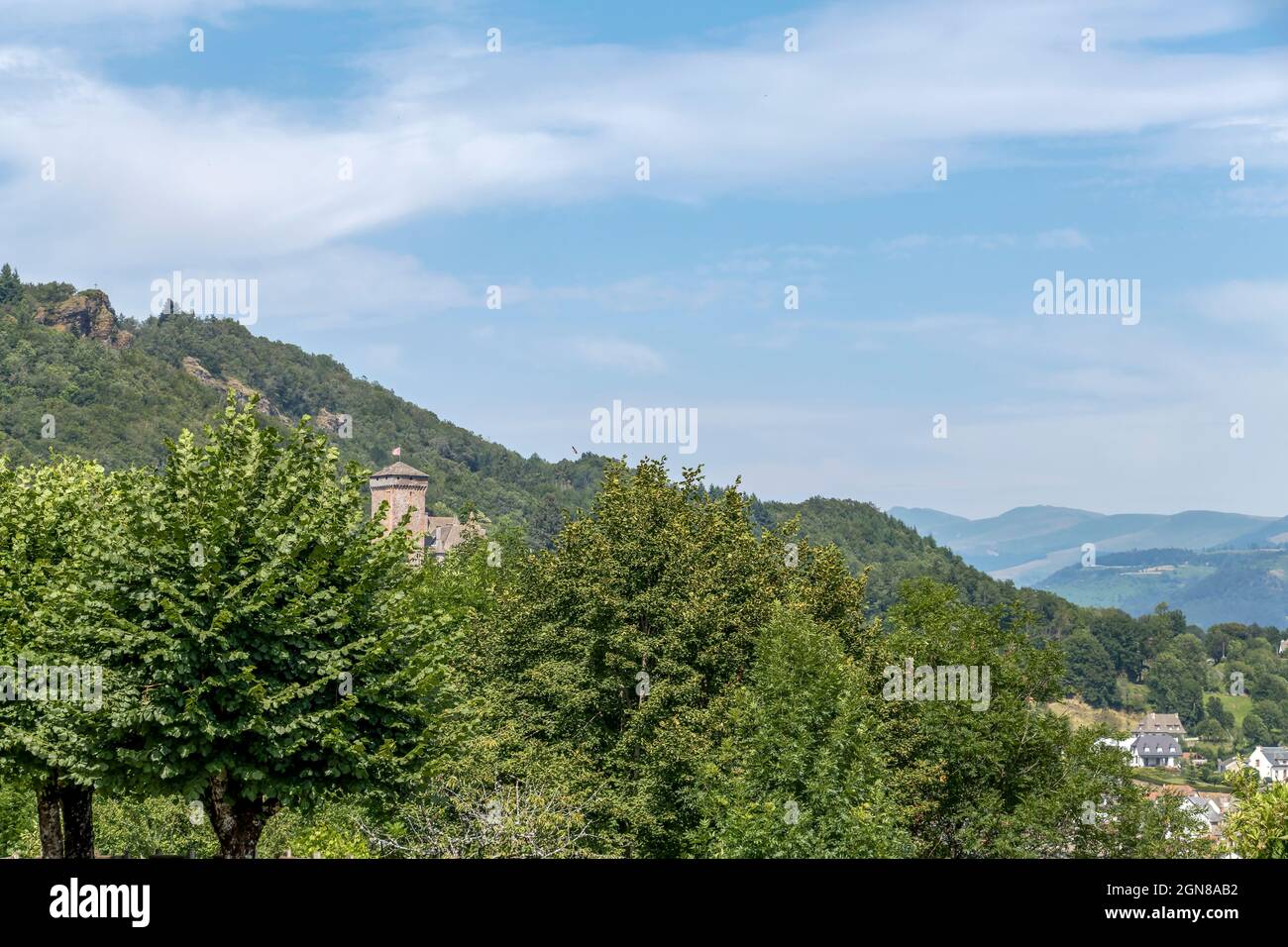 View on the hill and valley with small castle in the forest, french ...