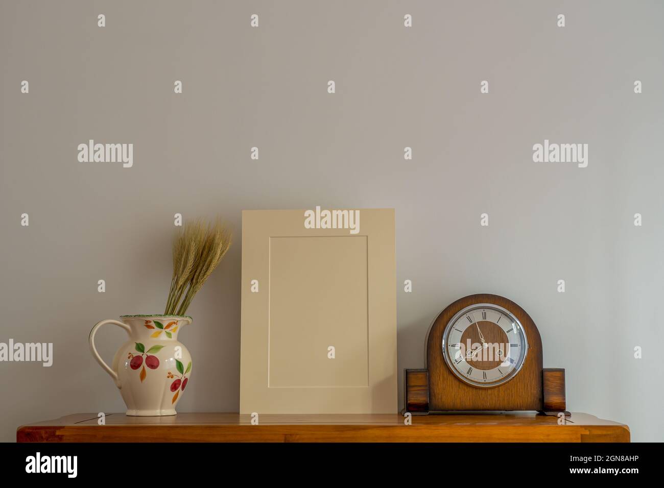 close up of still life mock up beige picture mount, antique timber ...