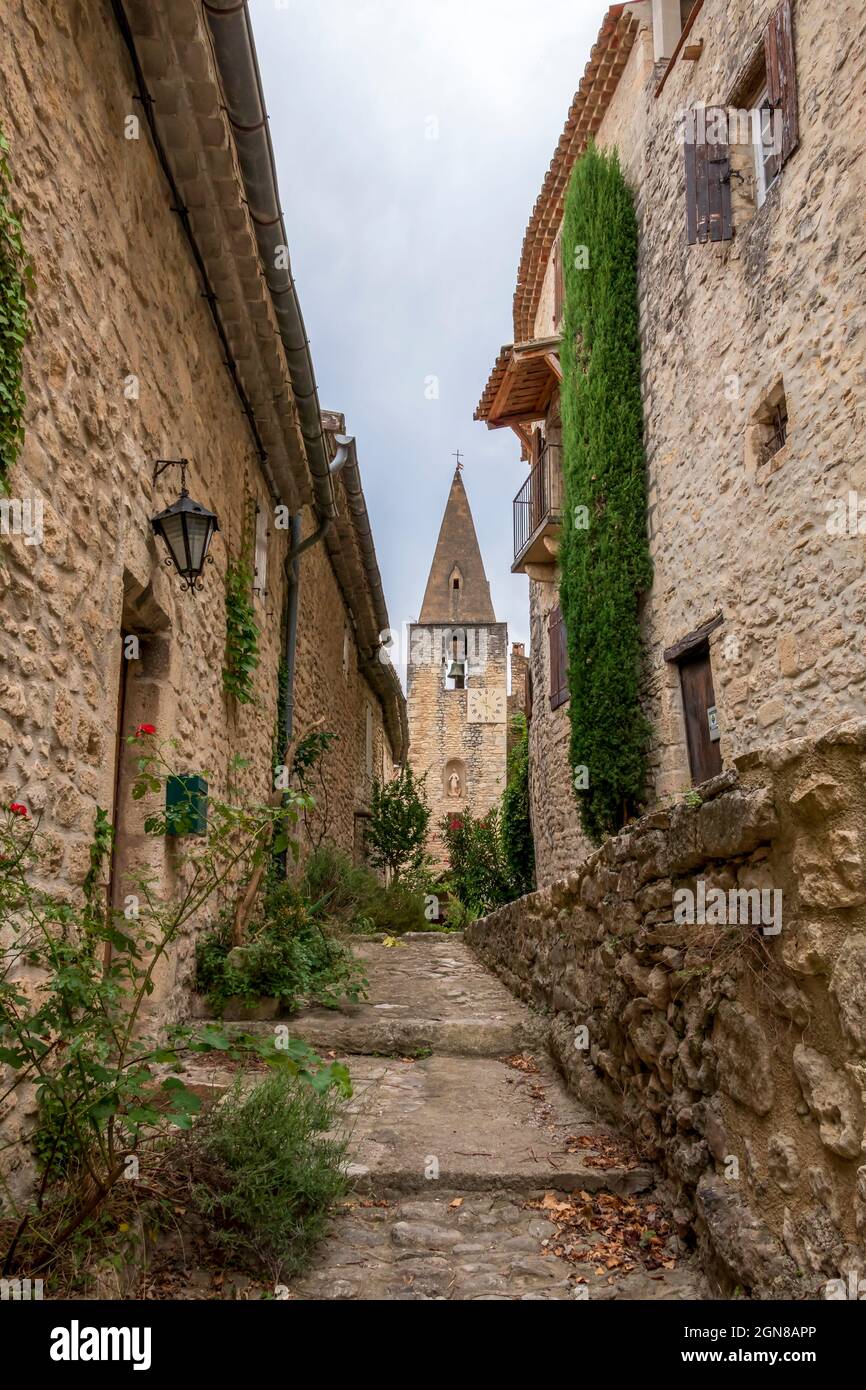 Crestet narrow street of typical provencal old town, medieval village ...