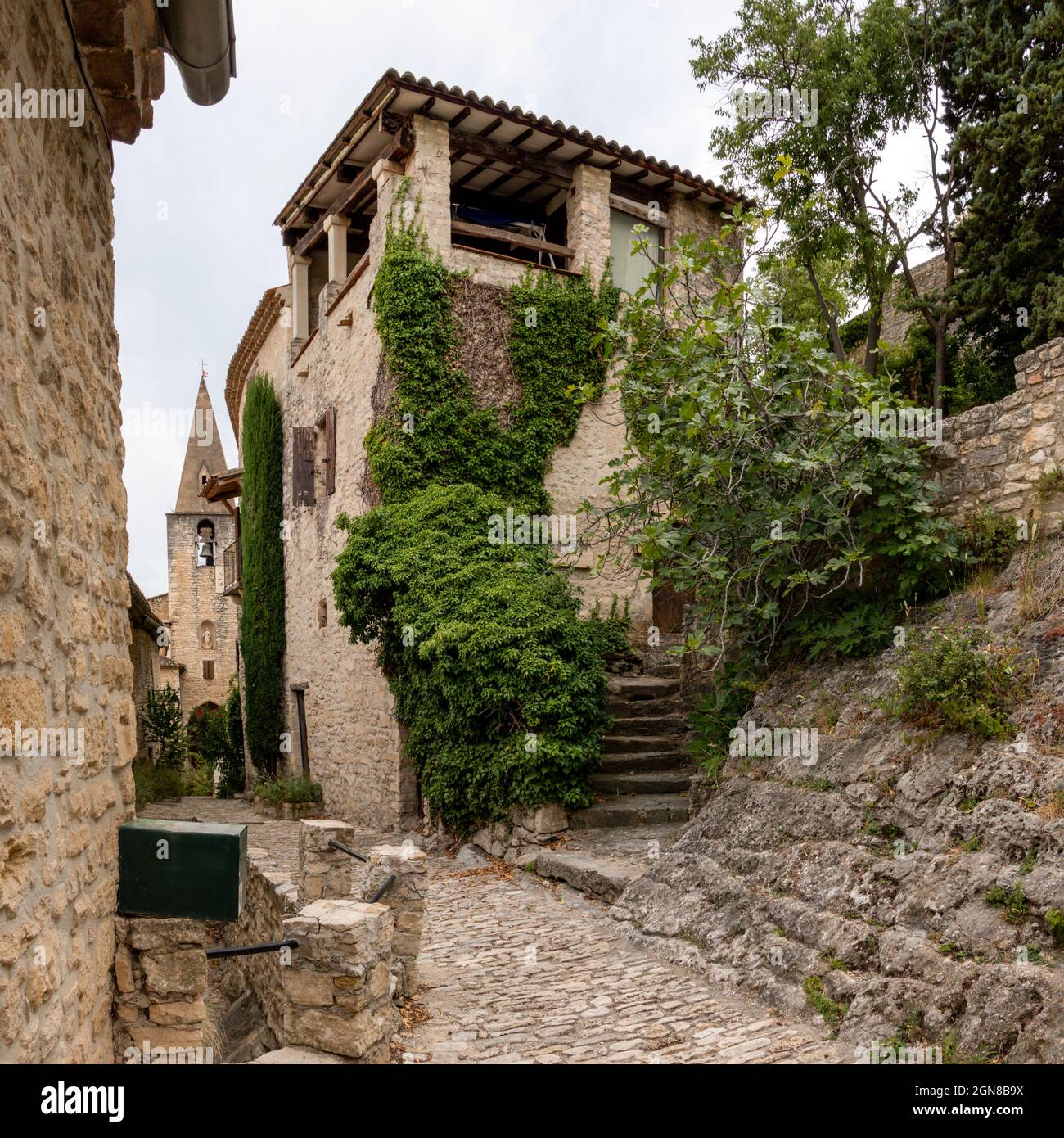 Crestet narrow street of typical provencal old town, medieval village ...