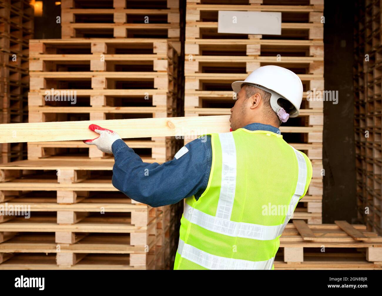 Carpenter checking the board Stock Photo - Alamy
