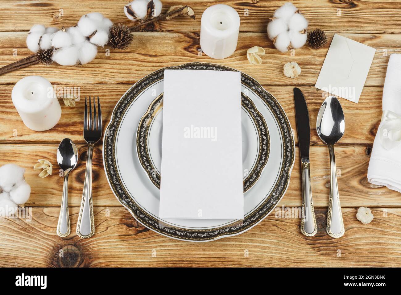 Beautiful table setting on wooden table from above Stock Photo - Alamy