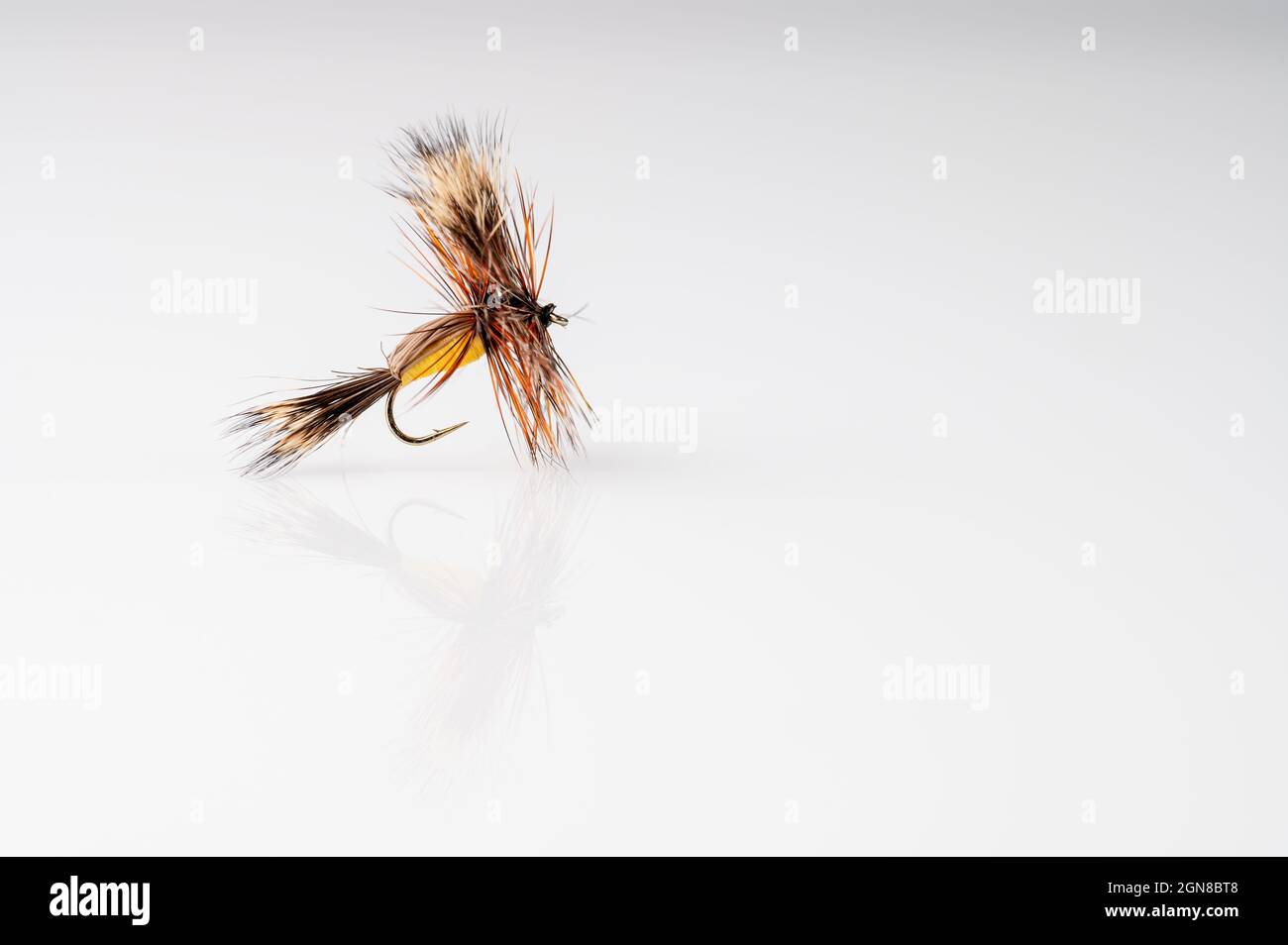 Traditional Yellow Humpy Dry Fly Fishing fly against a white background ...