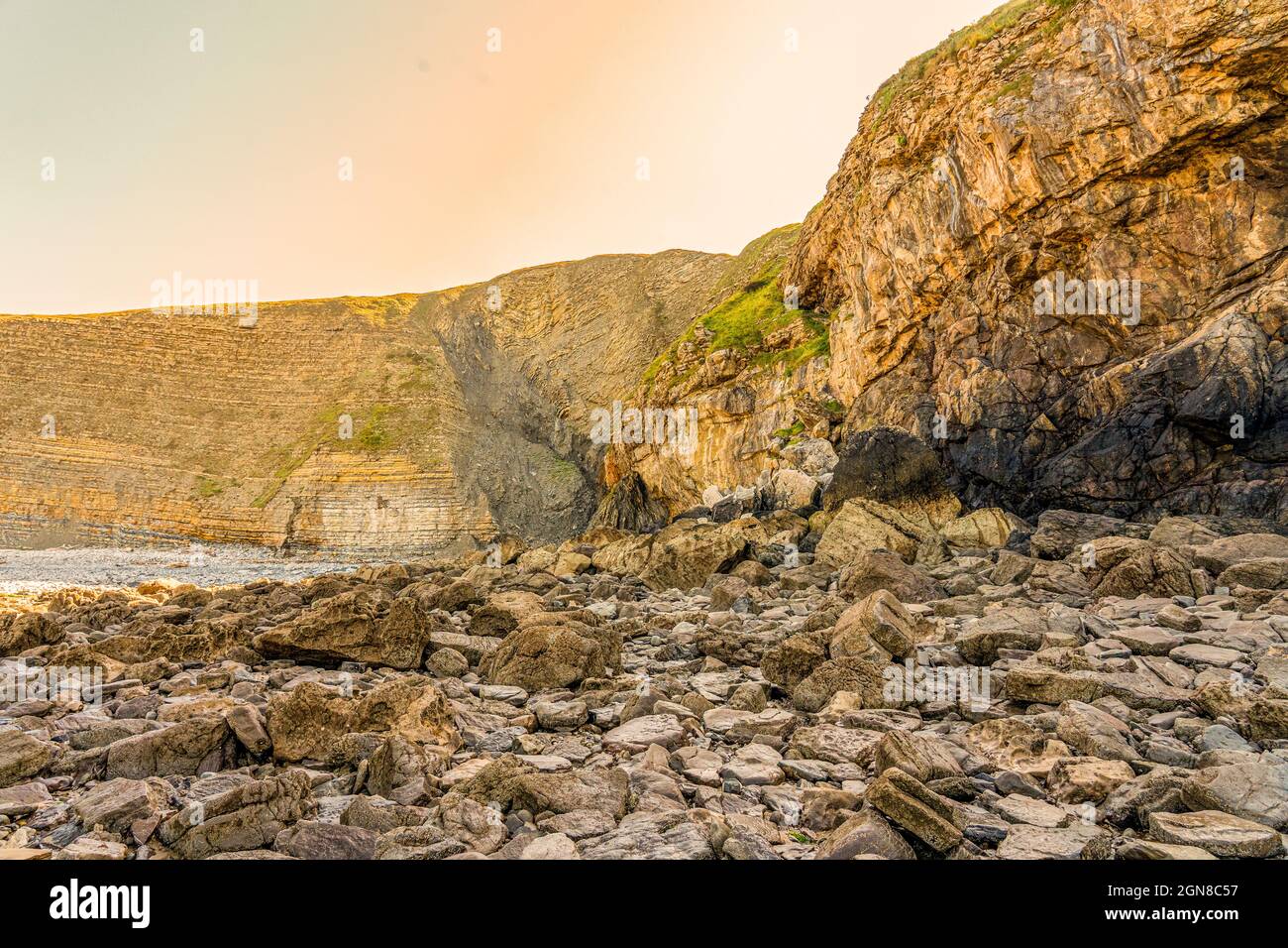 coastal erosion of cliff face rock fall onto the beach at Southerndown ...