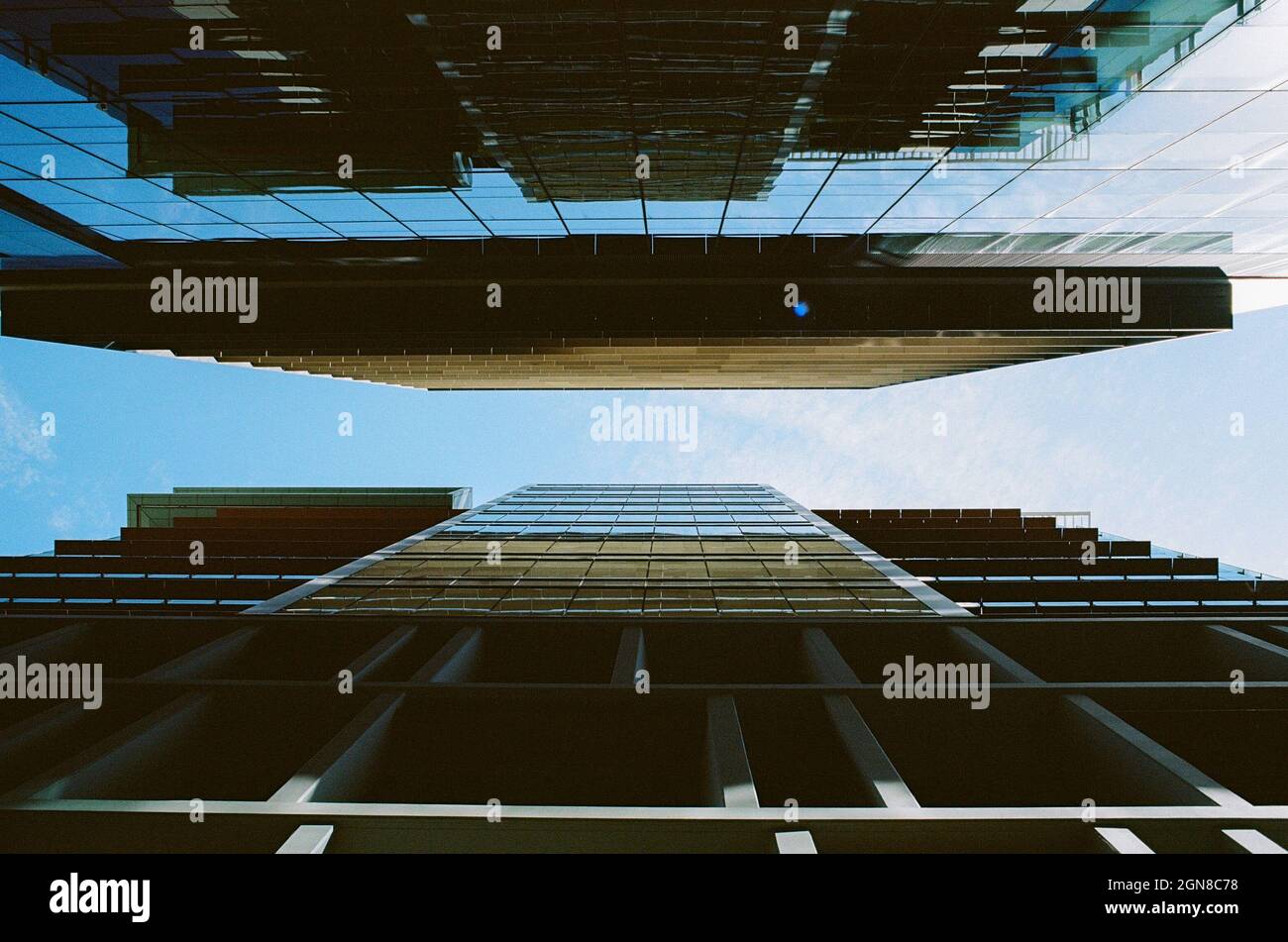 Low angle of two modern buildings with glass facade Stock Photo - Alamy