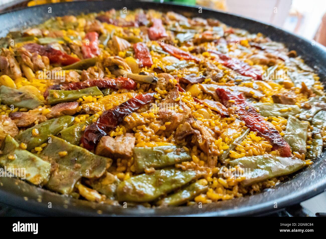 Serving of delicious paella on a p Stock Photo - Alamy