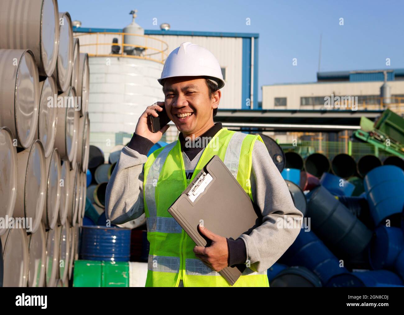 Worker man communication via phone Stock Photo - Alamy
