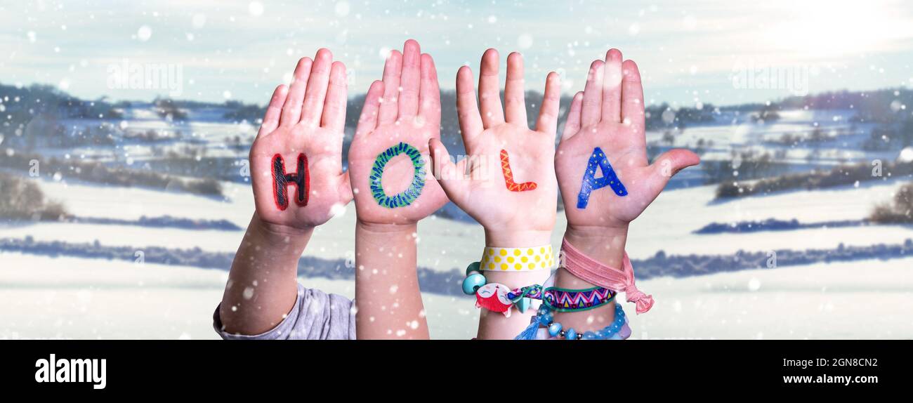 Kids Hands Holding Word Hola Means Hello, Snowy Winter Background Stock ...