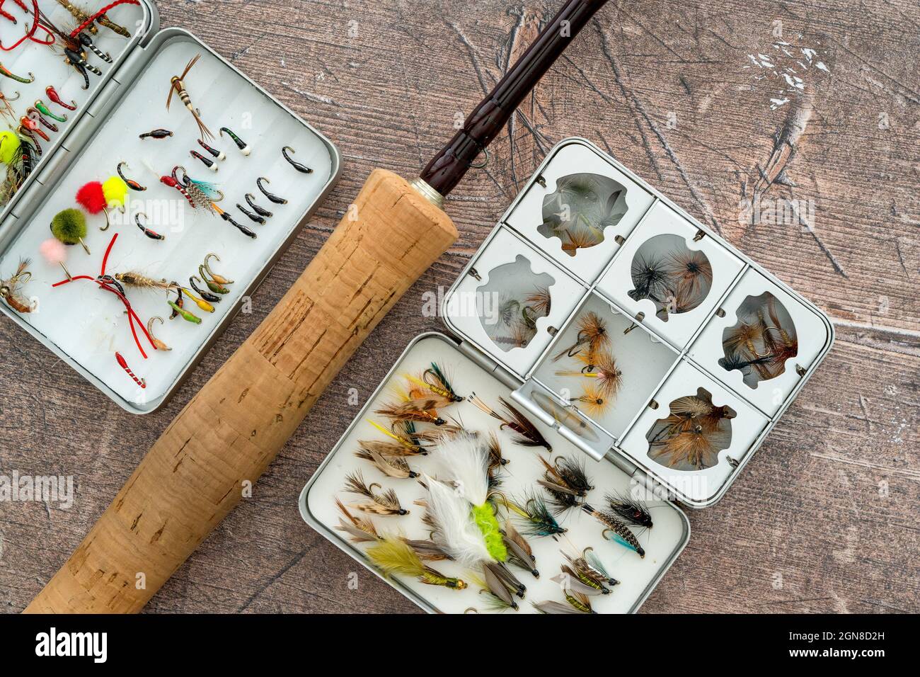 selected focus two antique aluminium fly fishing boxes and a fly rod ...