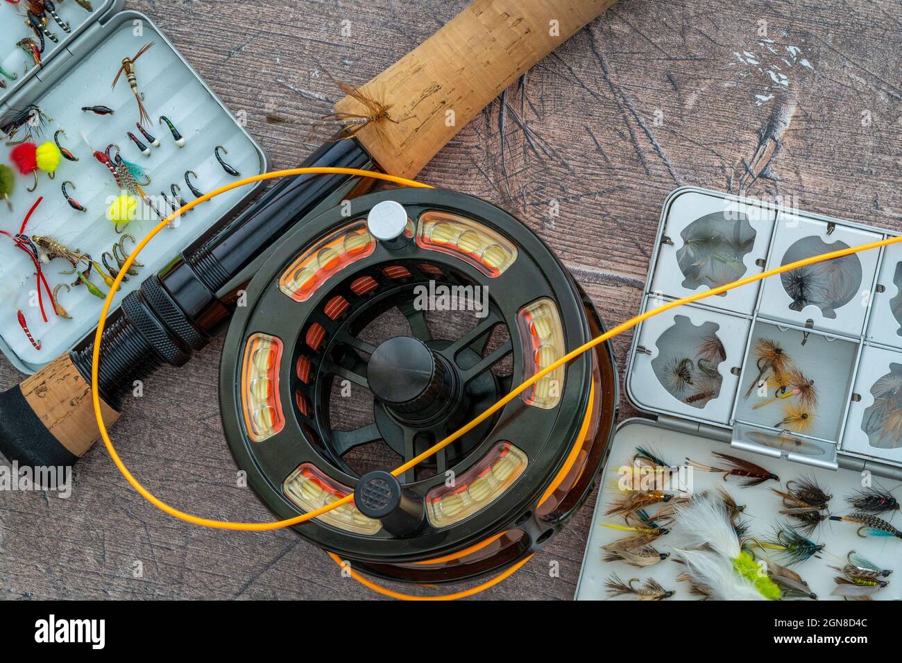 Close up selective focus of CNC Machined fishing reel and line on a ...