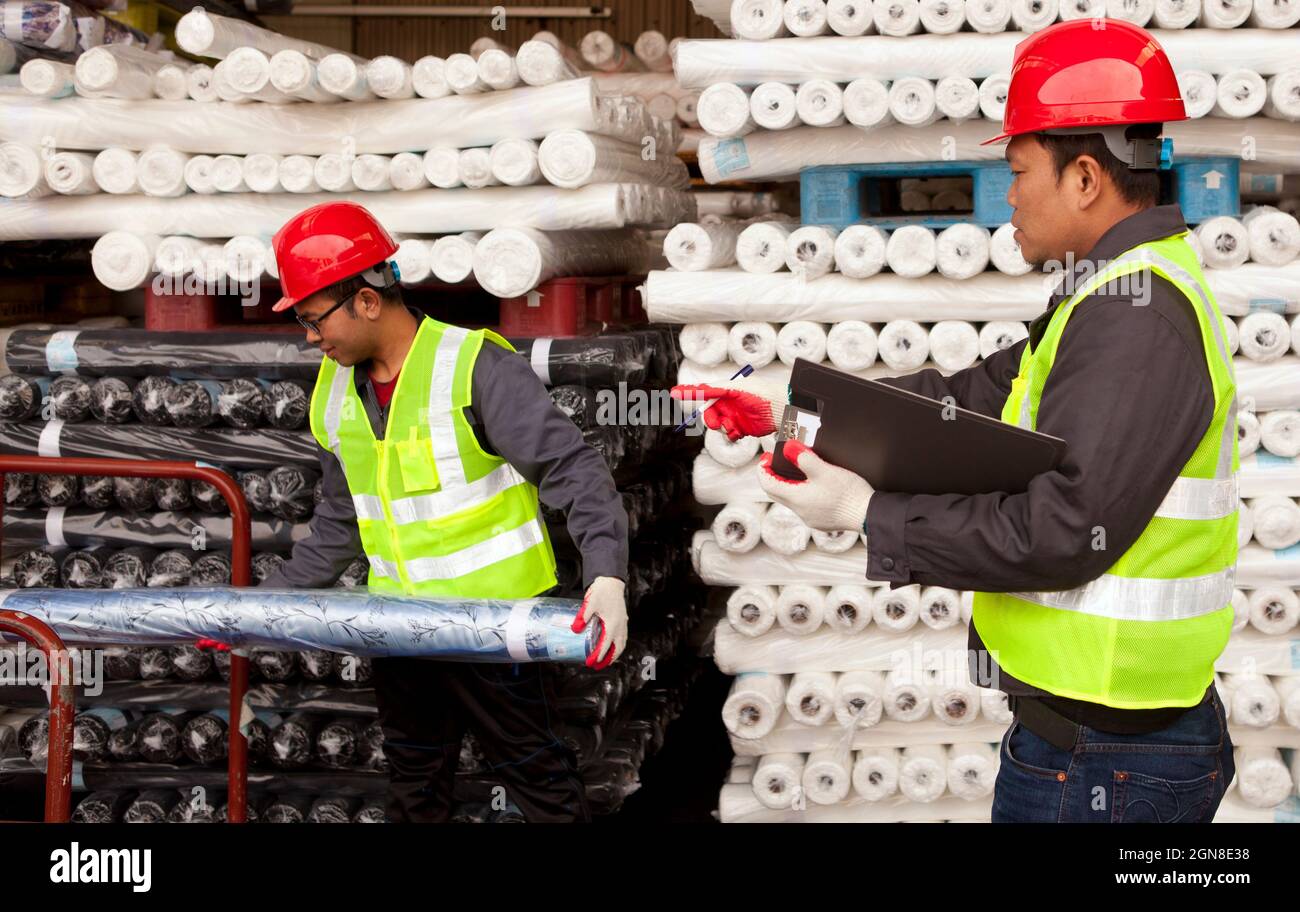 Textile factory workers on working Stock Photo - Alamy
