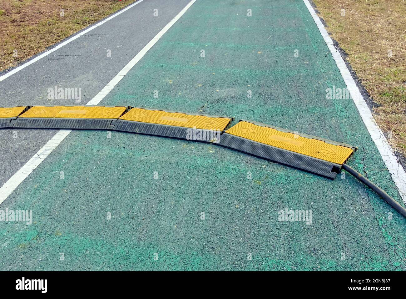 Black and yellow heavy plastic covers for people and vehicle to cross ...