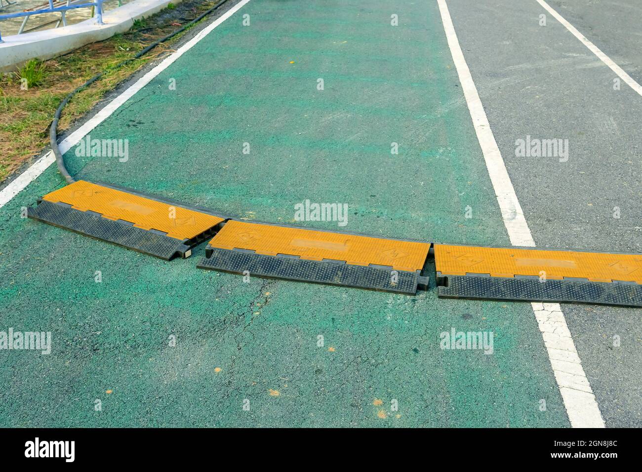 Black and yellow heavy plastic covers for people and vehicle to cross ...
