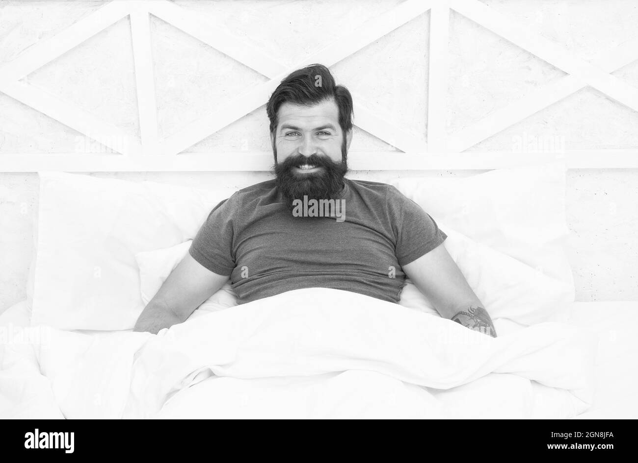 Man awakening on bed Black and White Stock Photos & Images - Alamy