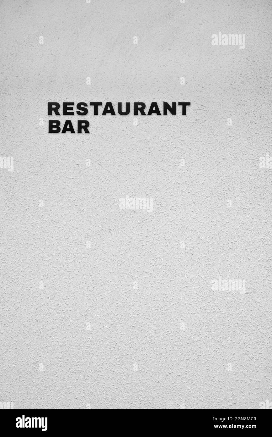 Minimalistic text "Restaurant Bar" in black on a white surface with ...