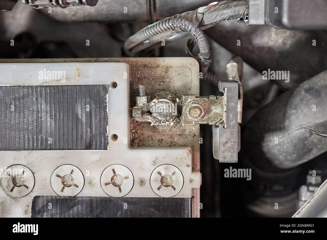 Old starter battery in a car Stock Photo - Alamy