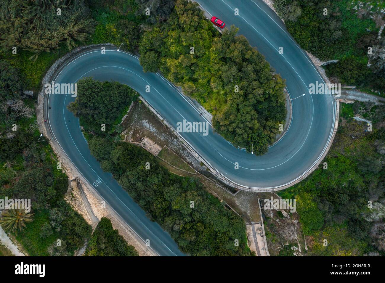Aerial view of winding asphalt road Stock Photo - Alamy