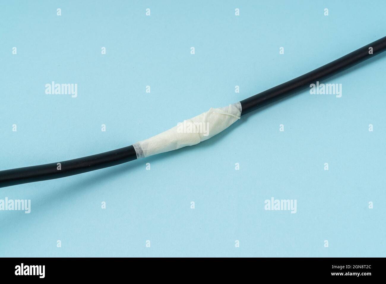 Bad practice wrap electric cable with a paper tape Stock Photo - Alamy