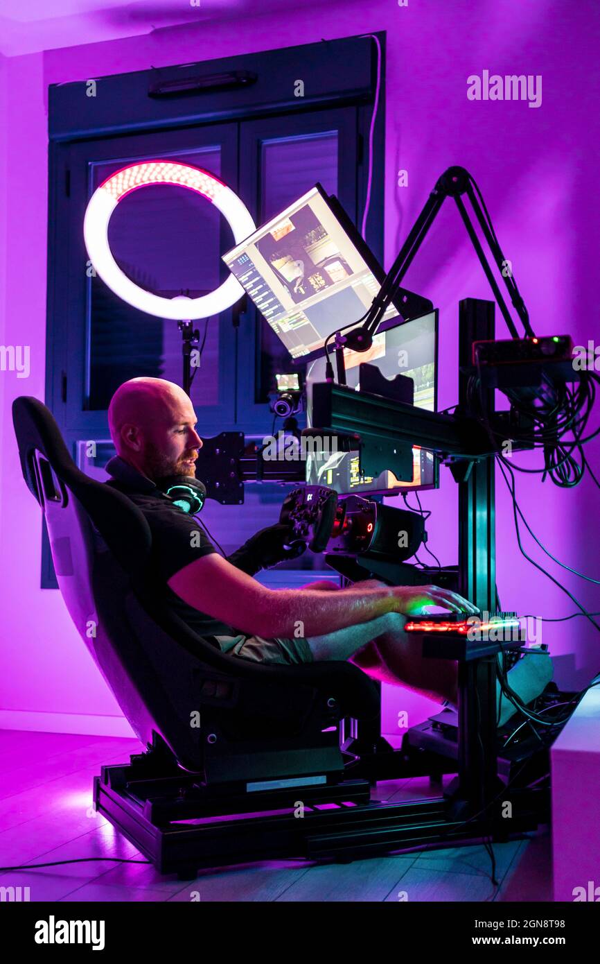 Bald male gamer playing video game at studio Stock Photo - Alamy