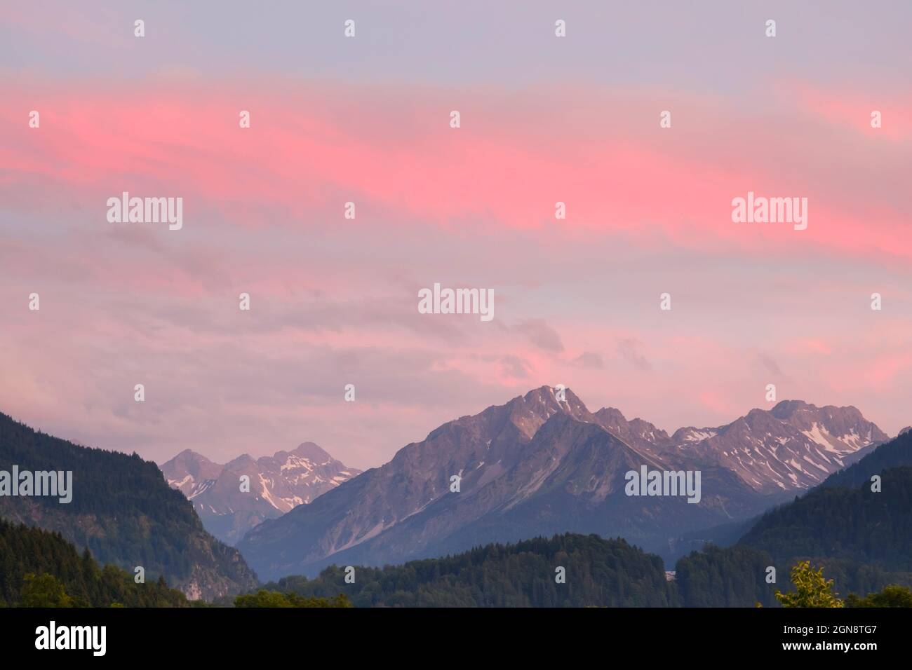 Peaks of Allgau Alps at moody dusk Stock Photo - Alamy