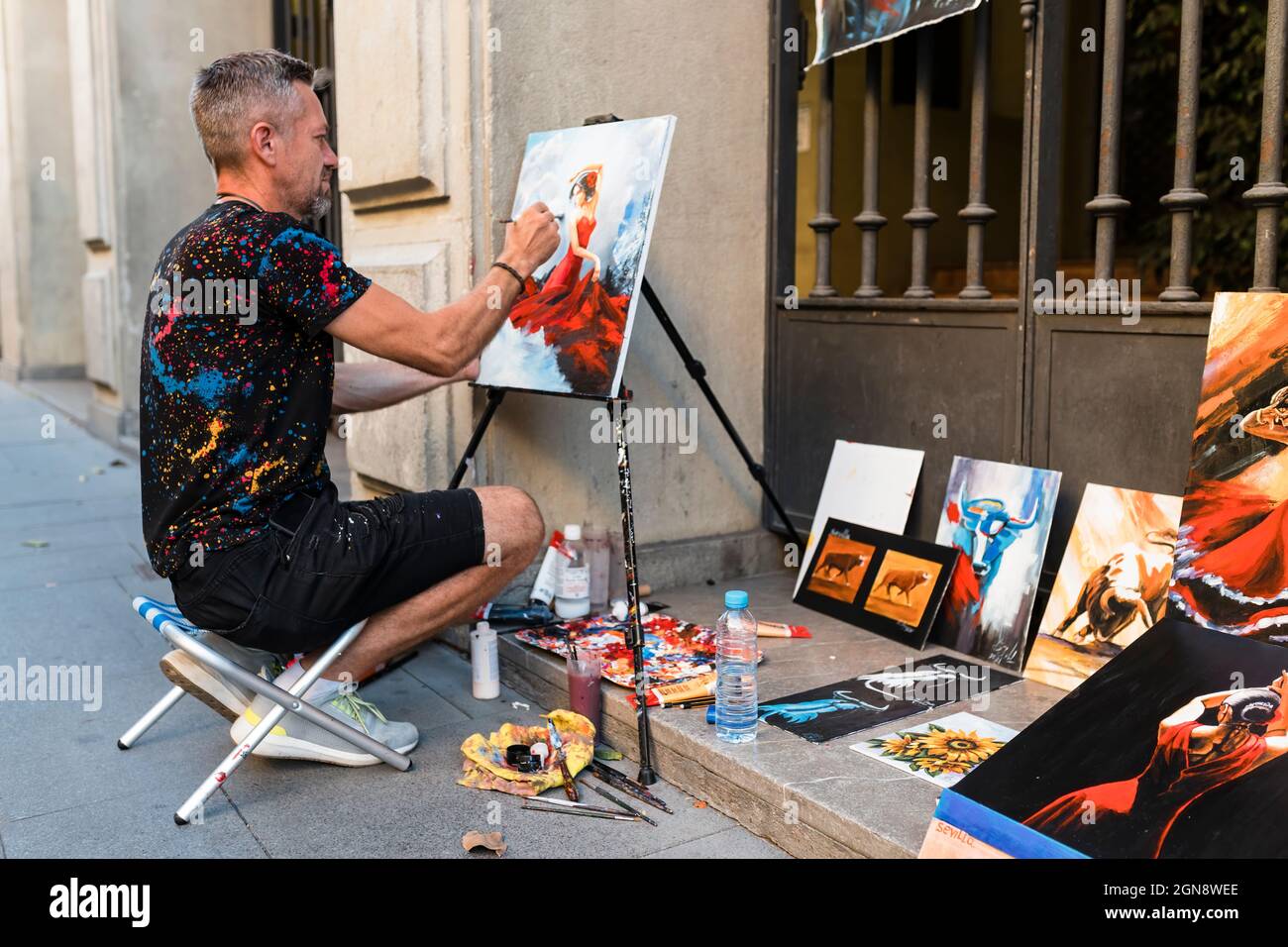 Painter Painting On Canvas