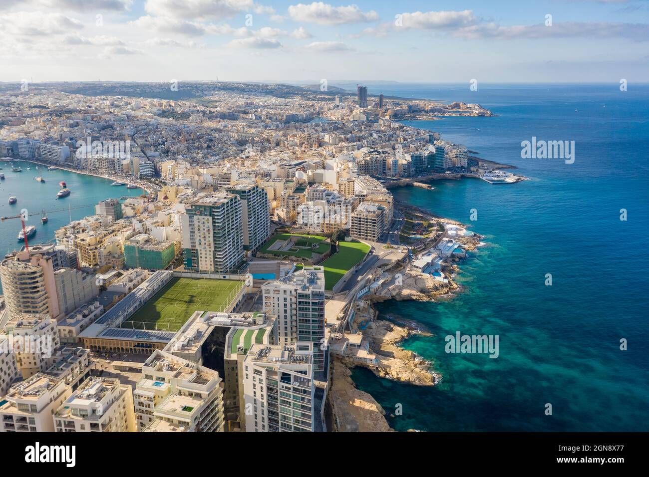 Malta, Central Region, Sliema, Aerial view of soccer field, apartments ...