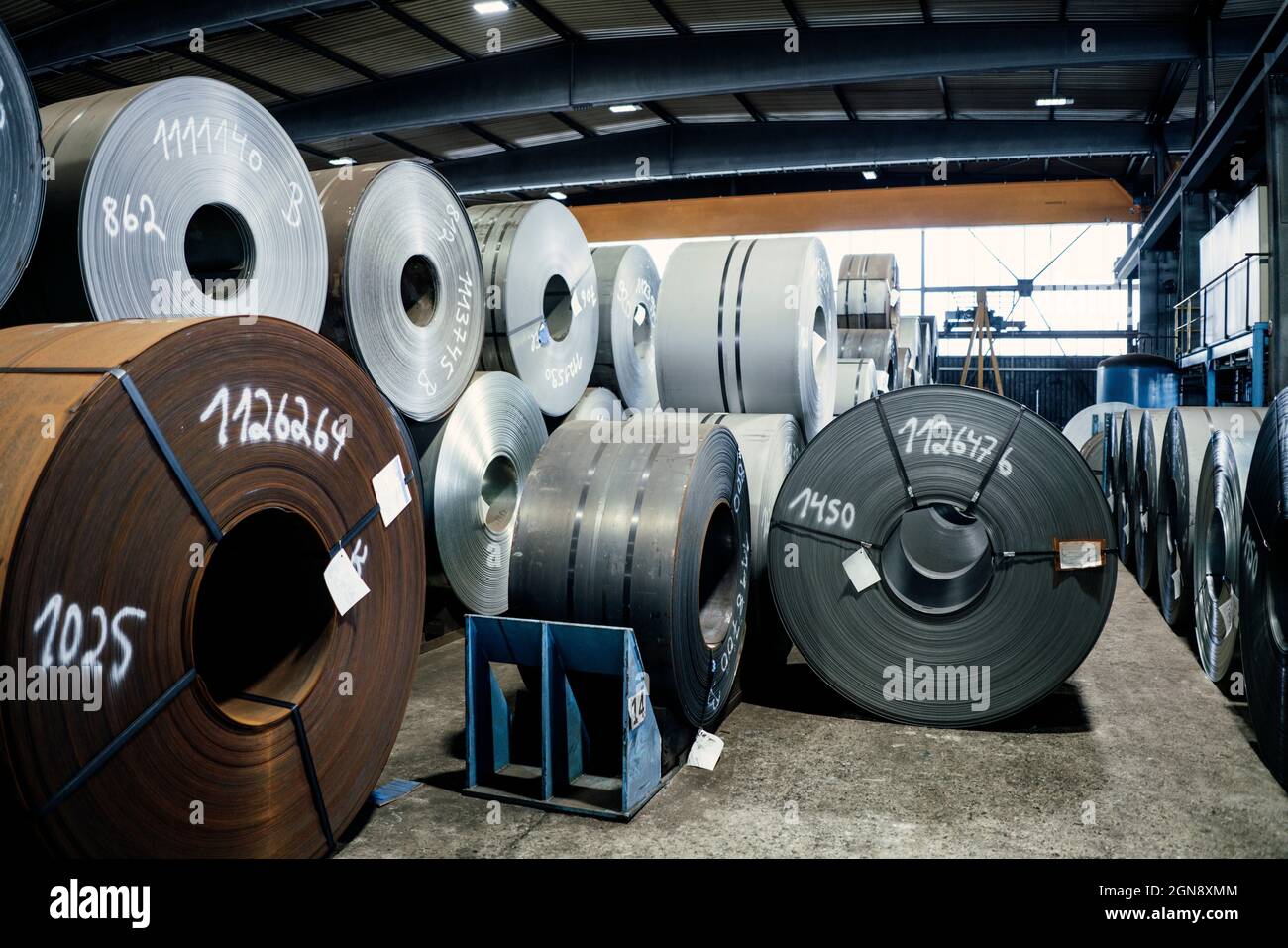 Metal sheet rolls with label at warehouse Stock Photo - Alamy