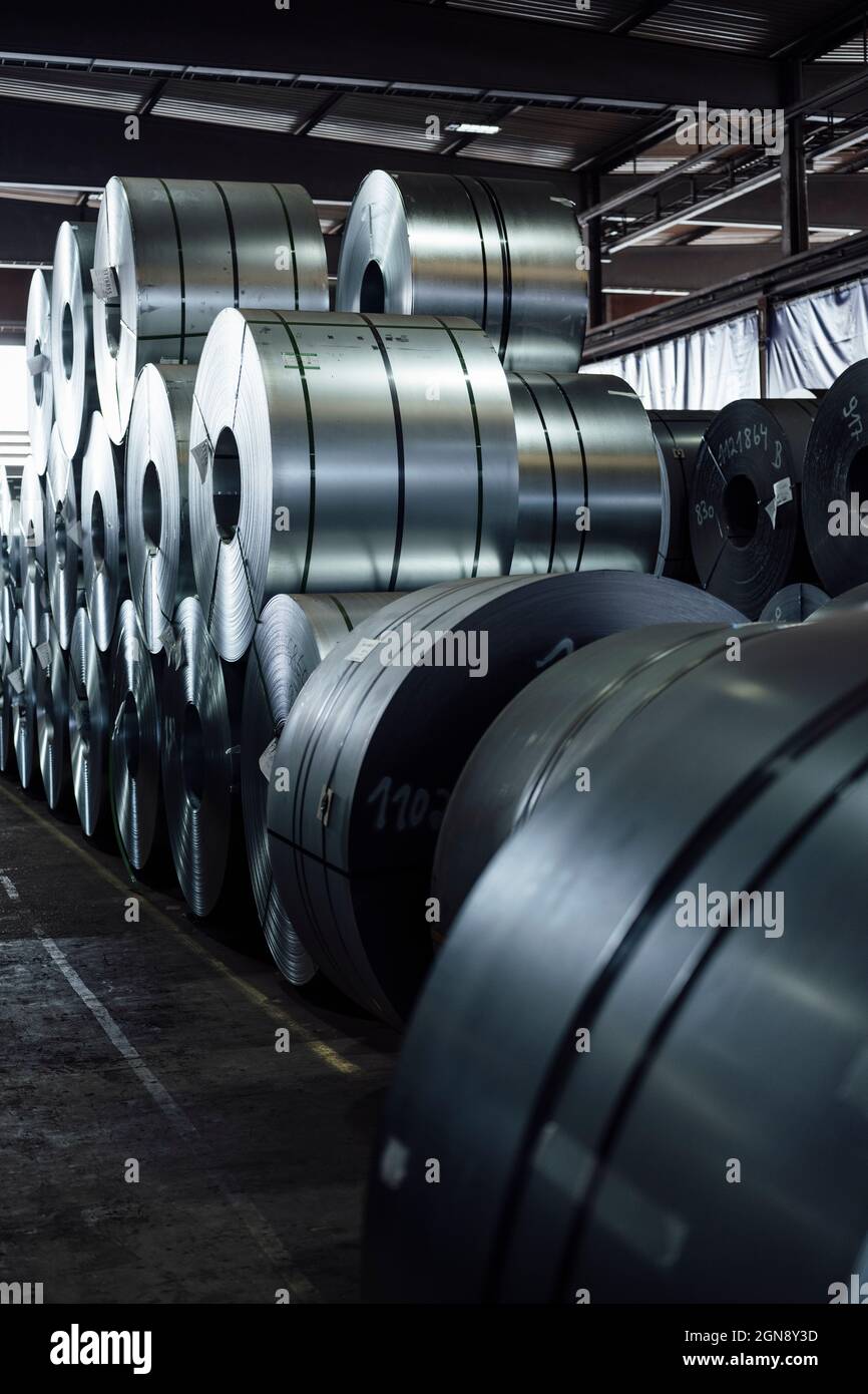 Manufactured steel sheet rolls stack in warehouse Stock Photo - Alamy