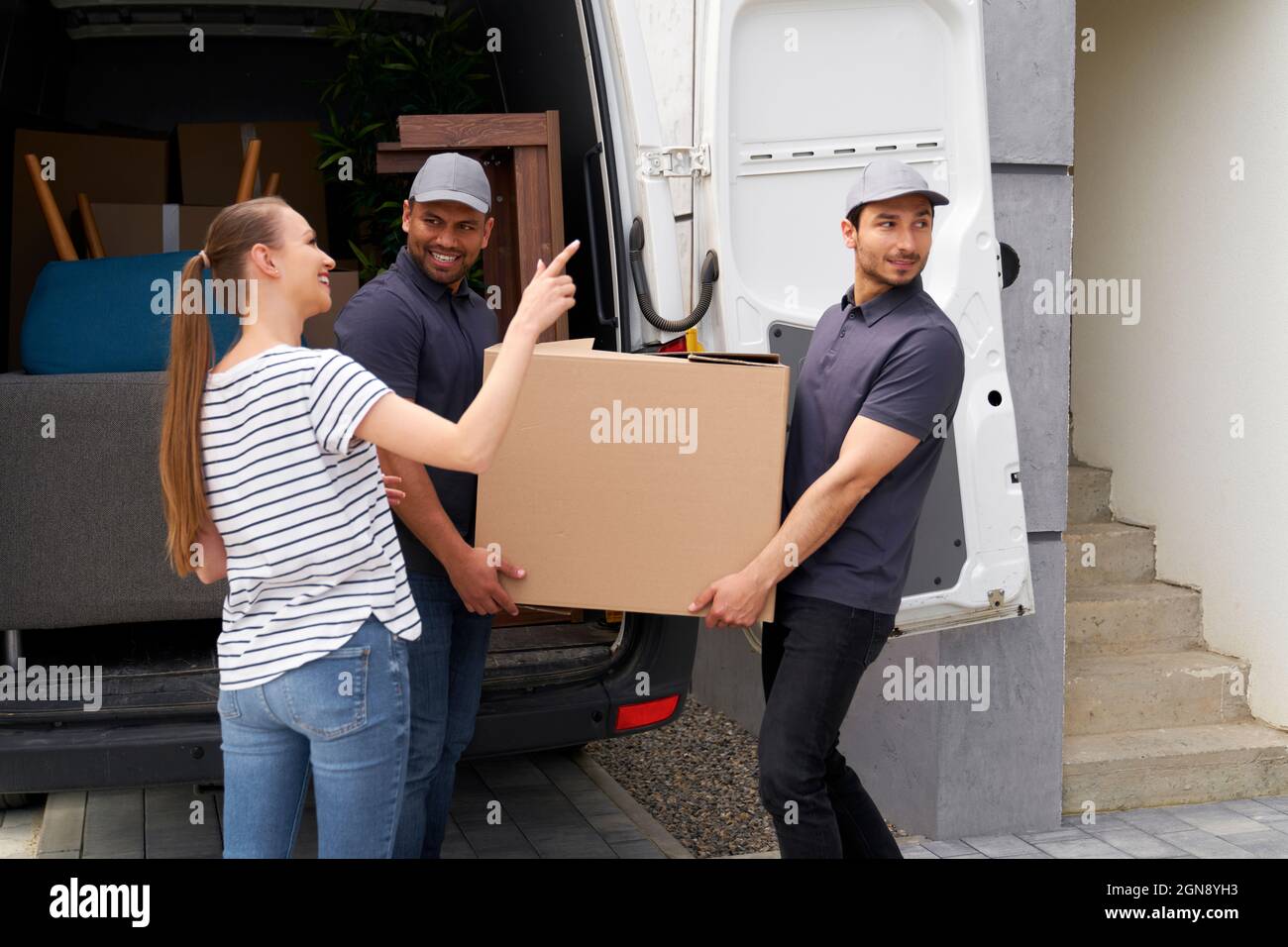 Men assisting hi-res stock photography and images - Alamy