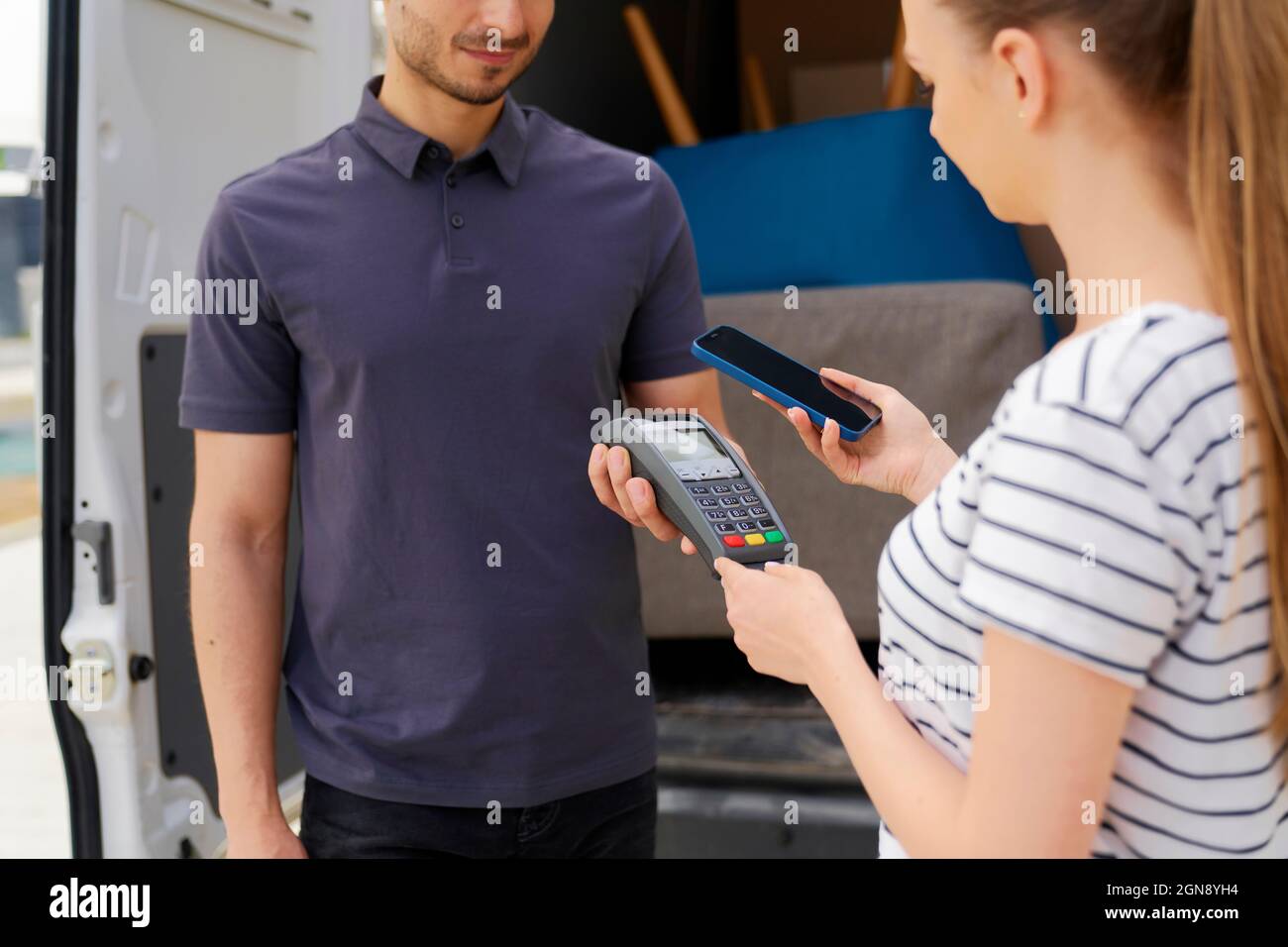 Female customer making online payment through smart phone Stock Photo ...