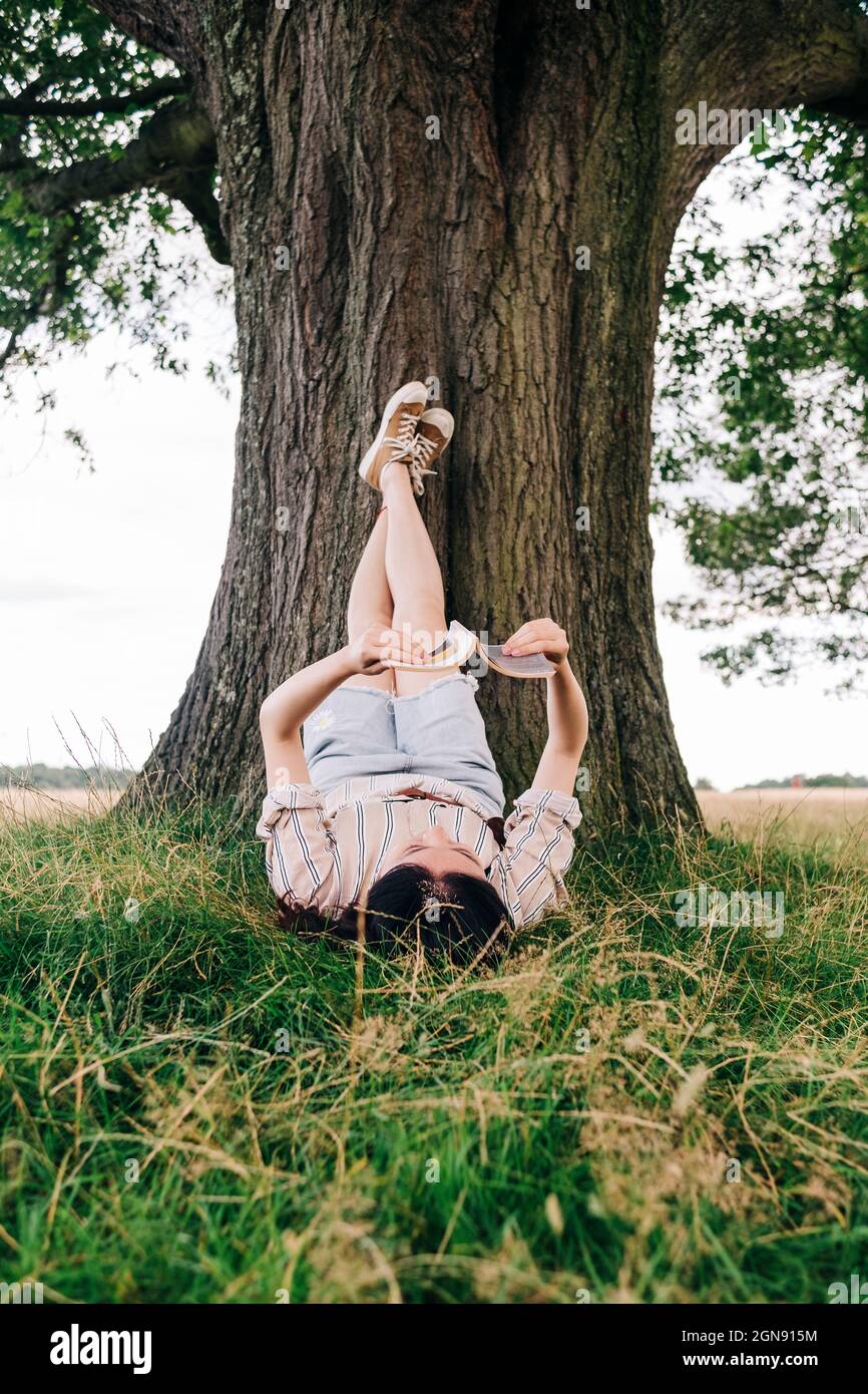 Woman lying back legs up hi-res stock photography and images - Alamy