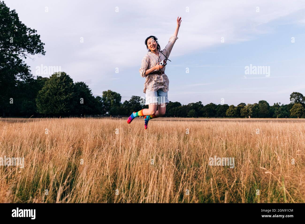 Asian jumping happy sky hi-res stock photography and images - Alamy