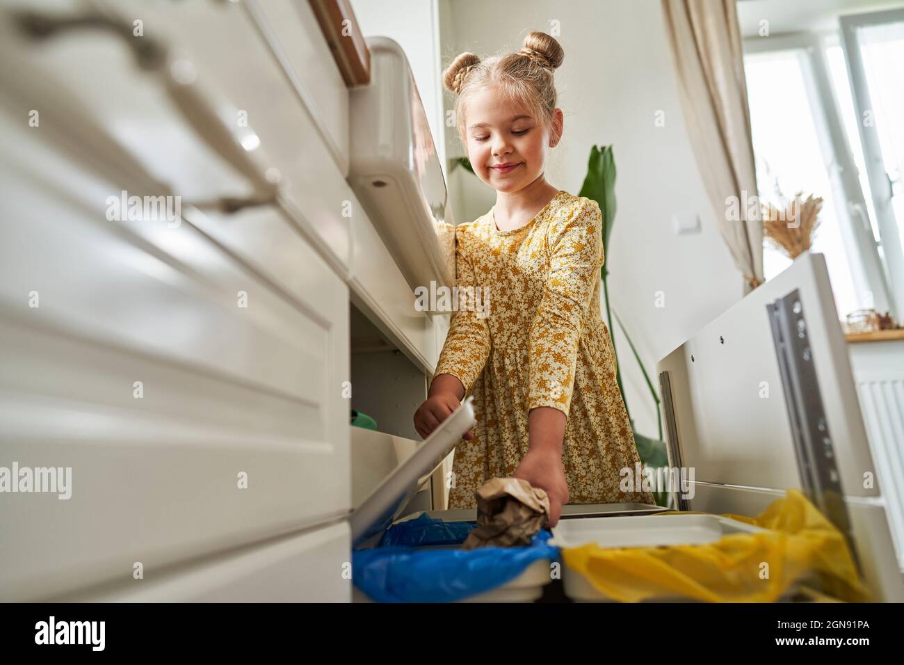 Child throwing garbage hi-res stock photography and images - Alamy