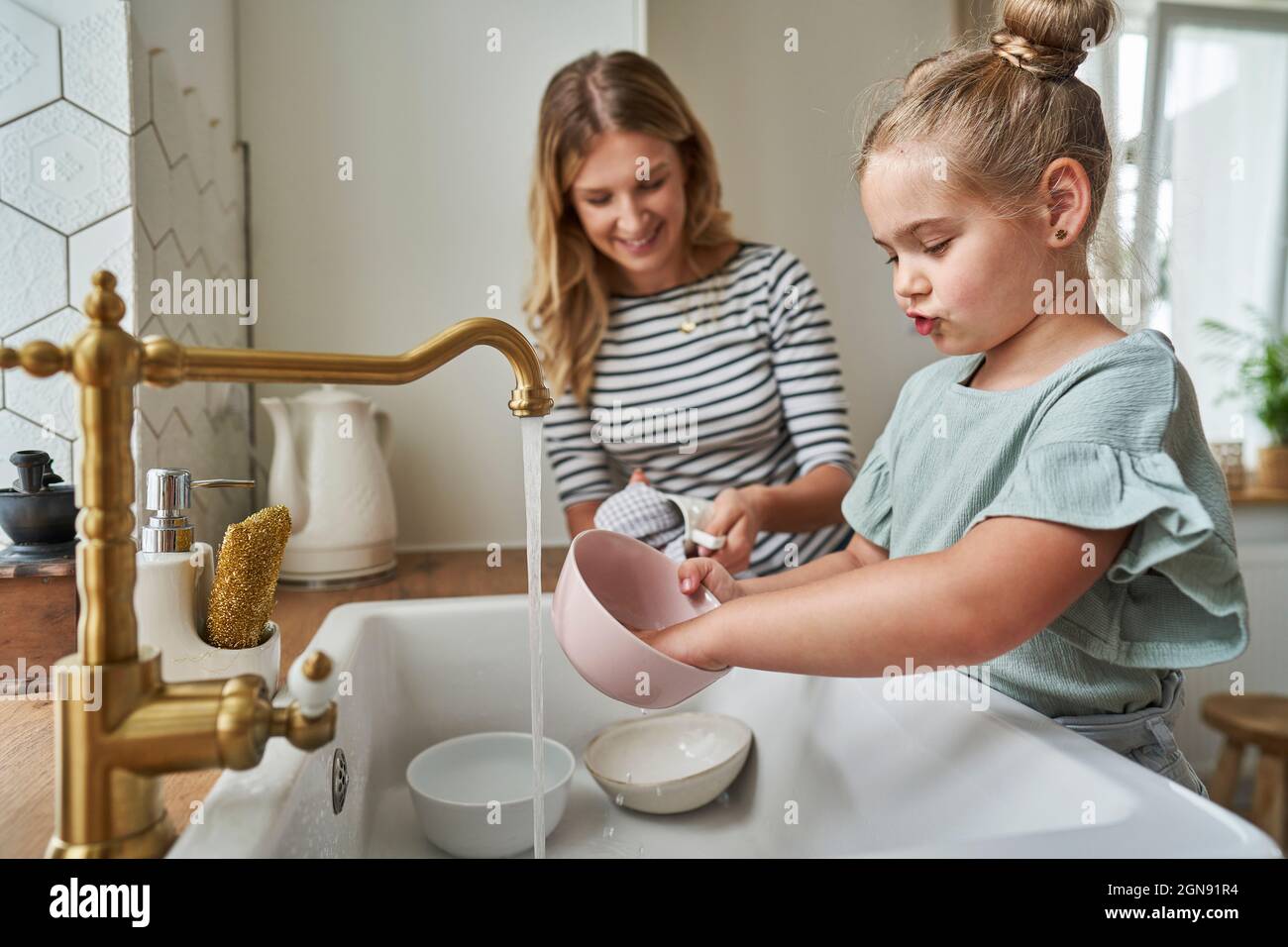 Mother Washing Dishes High Resolution Stock Photography and Images - Alamy