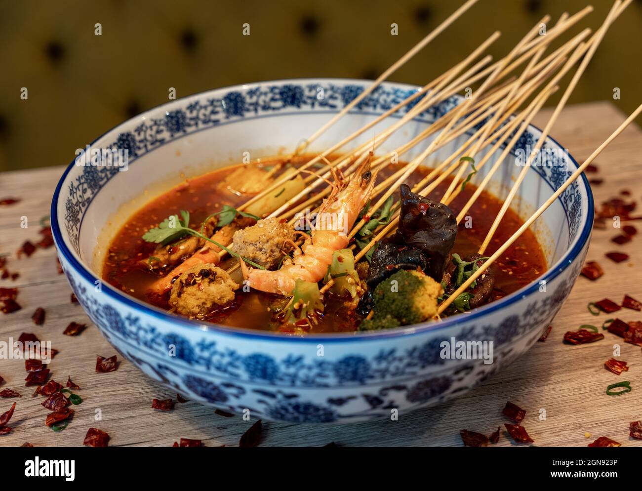 Traditional Chinese hot pot, spicy dish containing prawns, tofu ...