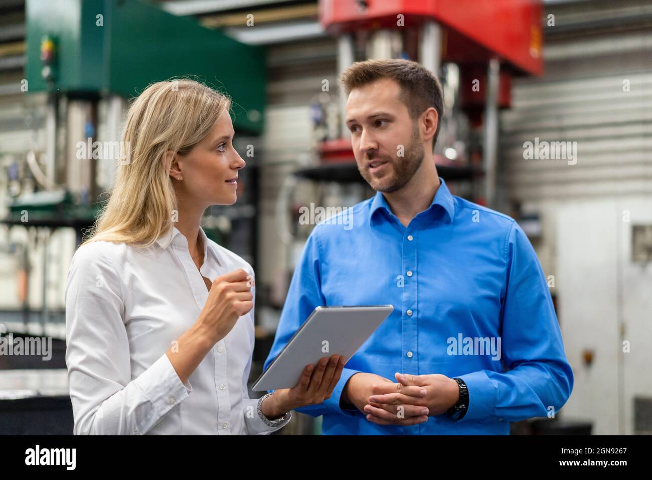 Female coworker working foreground hi-res stock photography and images ...