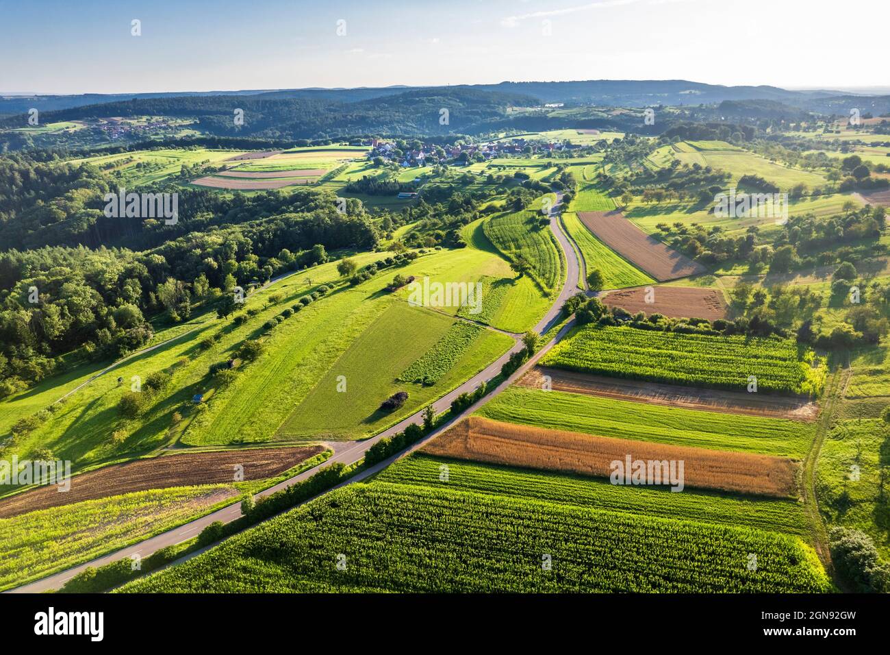 Germany, Baden-Wurttemberg, Drone view of country road and green ...