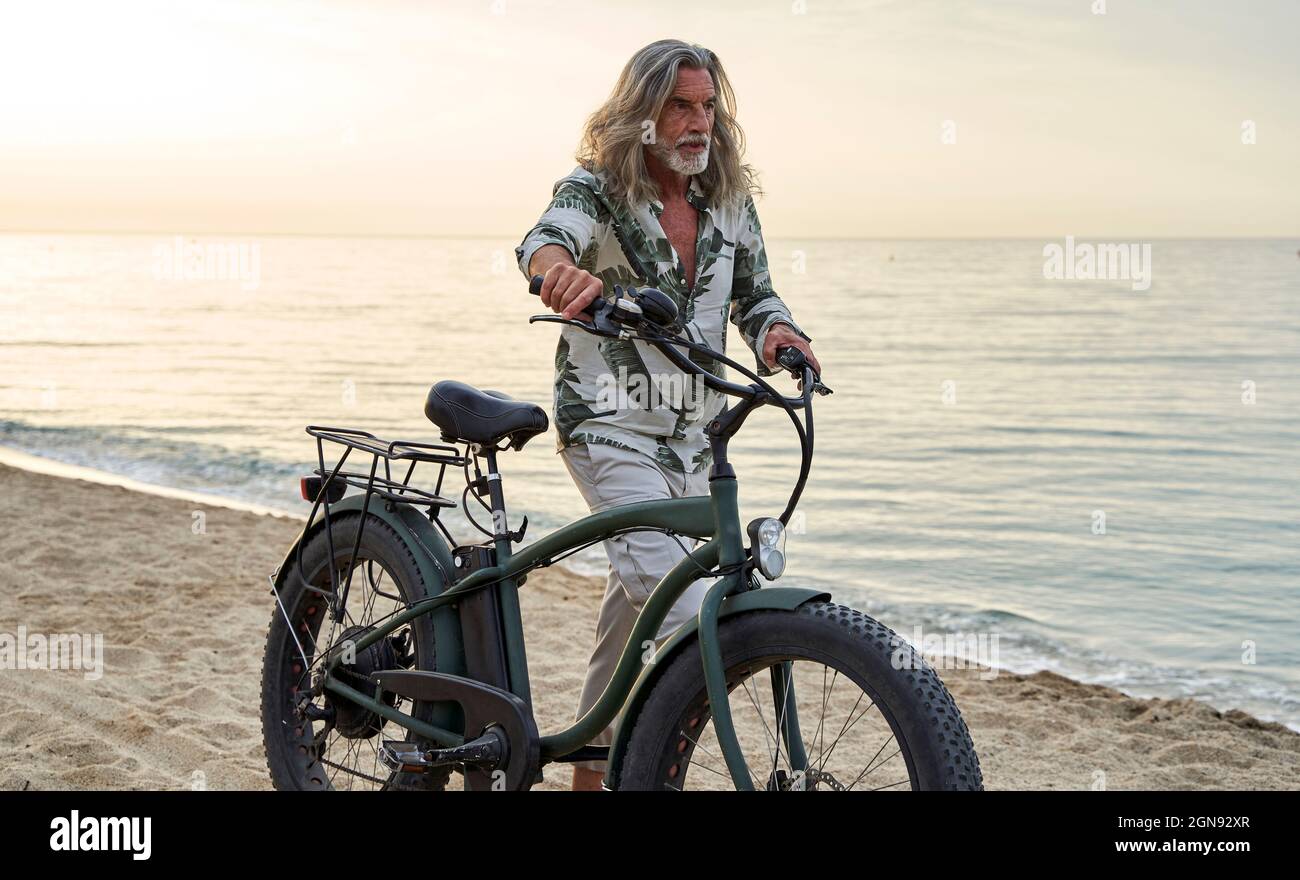 Man walking bicycle hi-res stock photography and images - Alamy