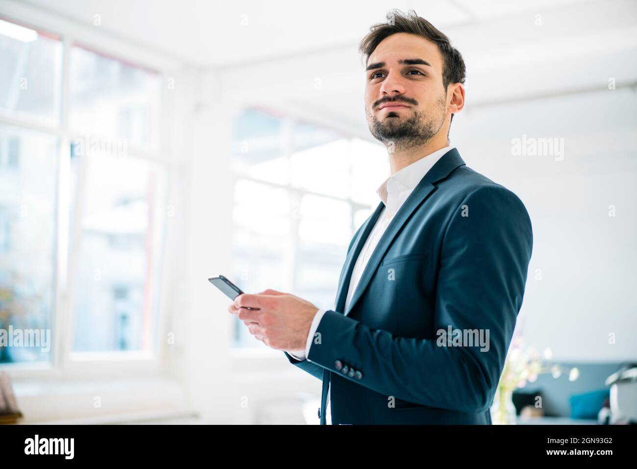 Professional smart young man hi-res stock photography and images - Alamy