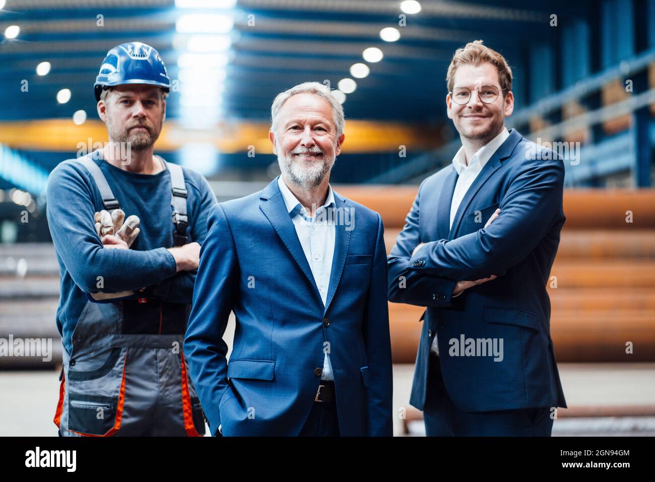 Confident male professionals standing at warehouse Stock Photo - Alamy